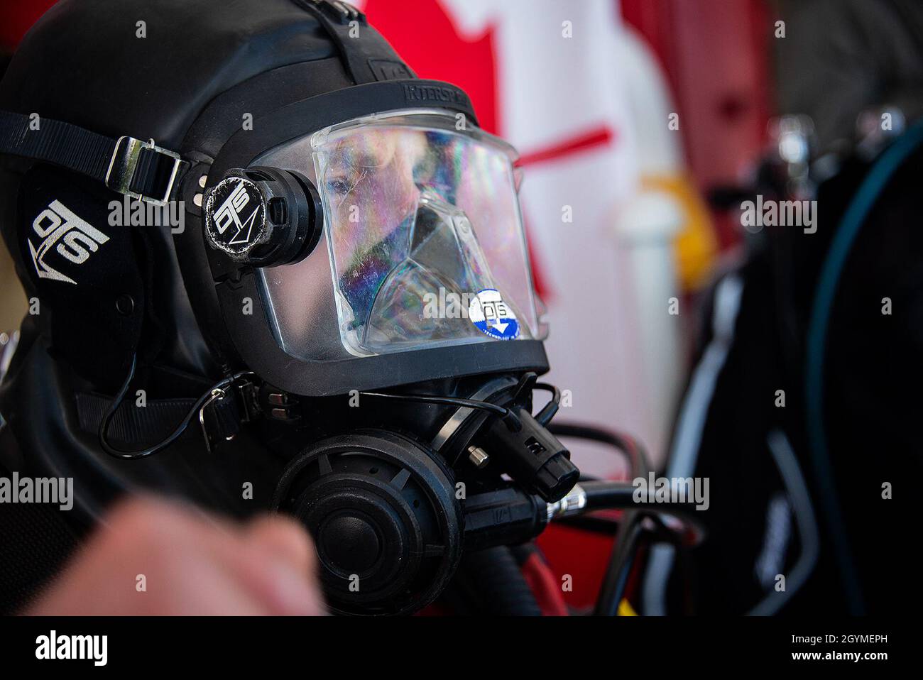 U.S. Coast Guard Petty Officer 1st Class Andres Murtillo wears a scuba ...