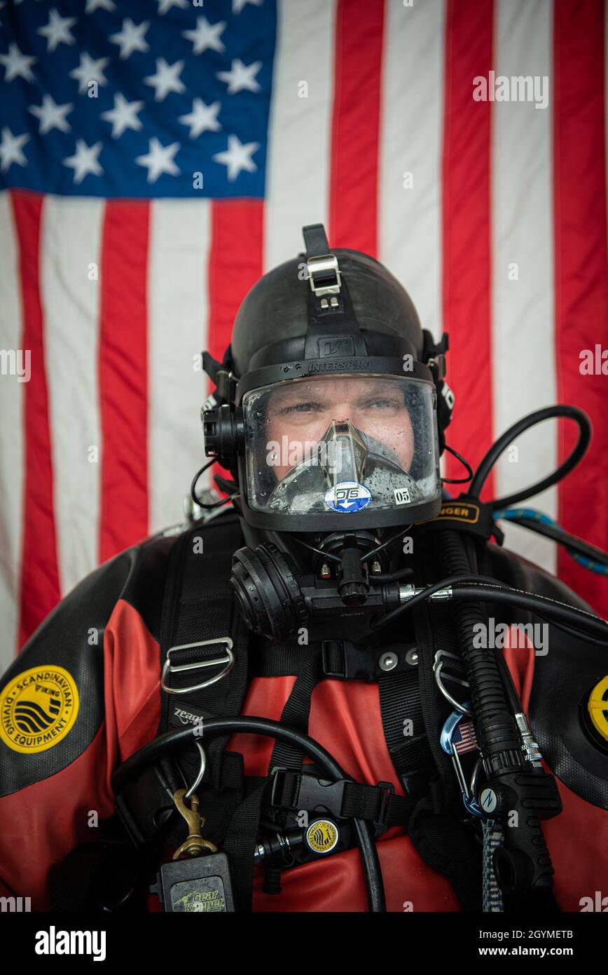 U.S. Coast Guard Chief Petty Officer David Partin is outfitted in his ...