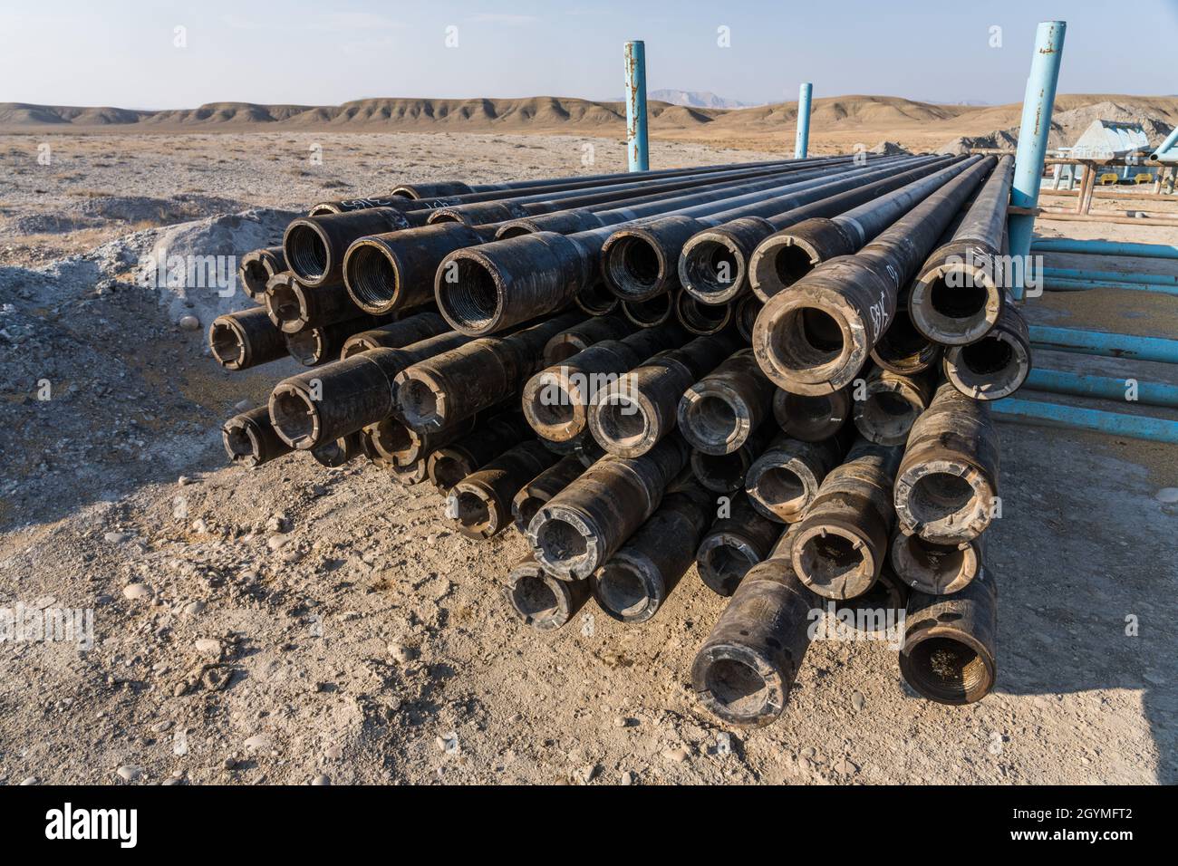 Heavy duty drill pipe on a pipe rack for drilling an oil well Stock ...