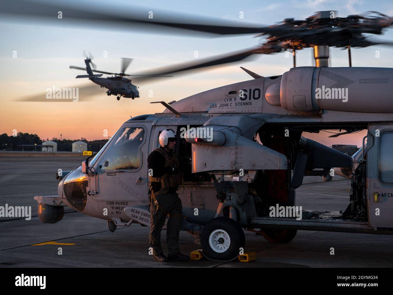 A U.S. Navy MH-60S Seahawk aircrew member, assigned to the Helicopter ...