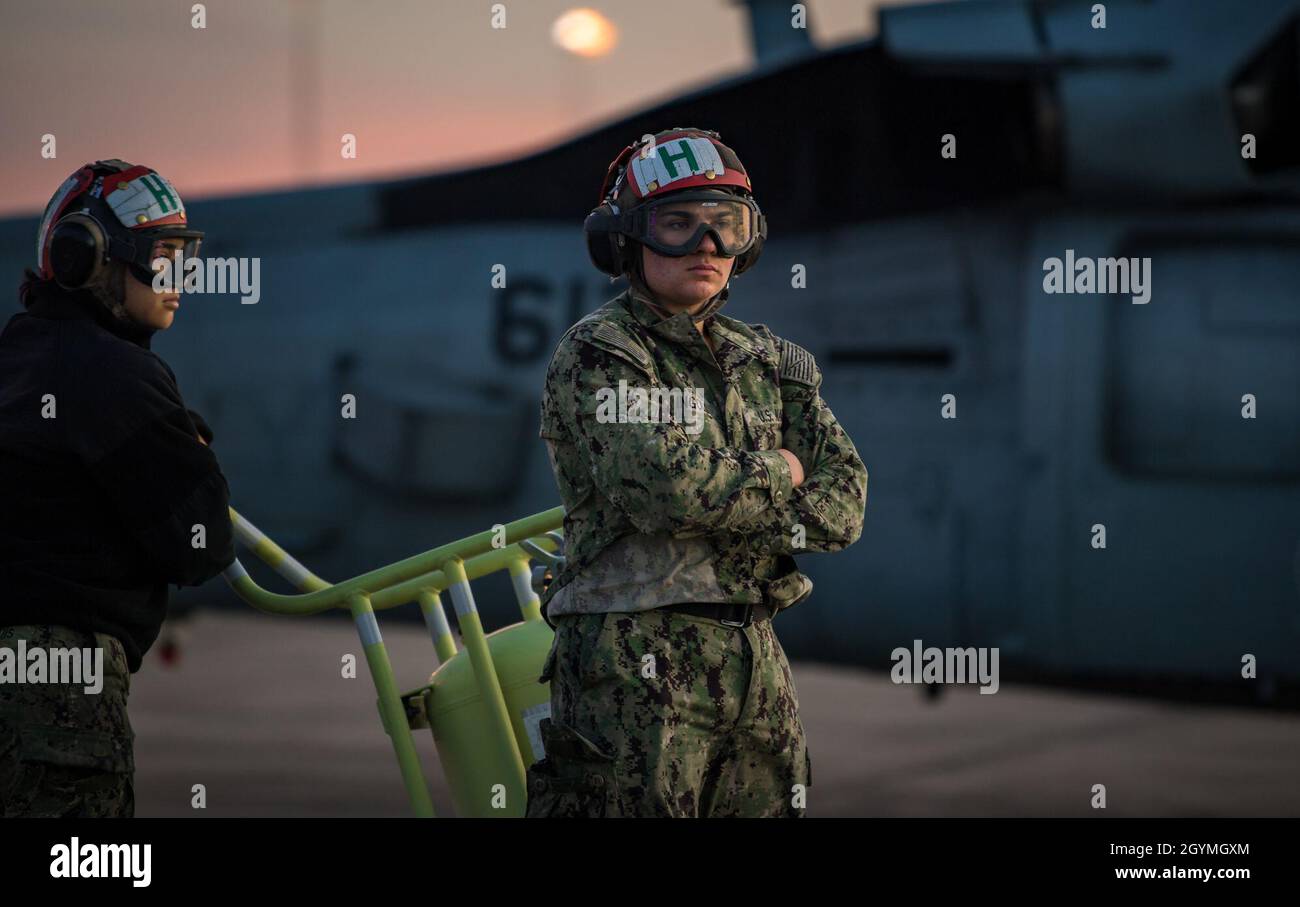 A U.S. Navy MH-60S Seahawk crew chief, assigned to the Helicopter Sea ...