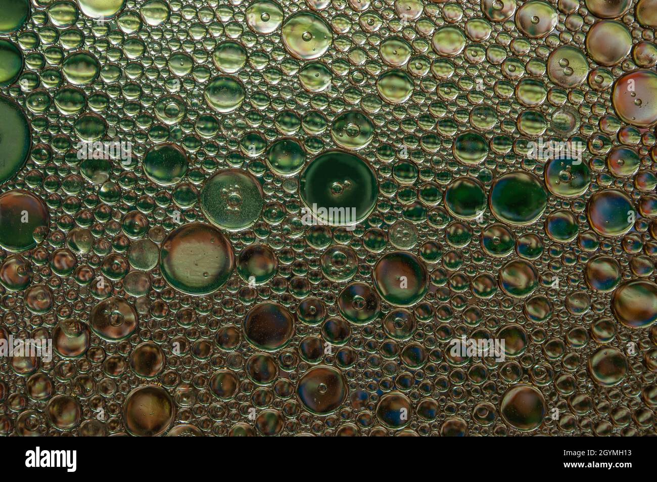 Abstract background and texture of oil drops on water with different ...