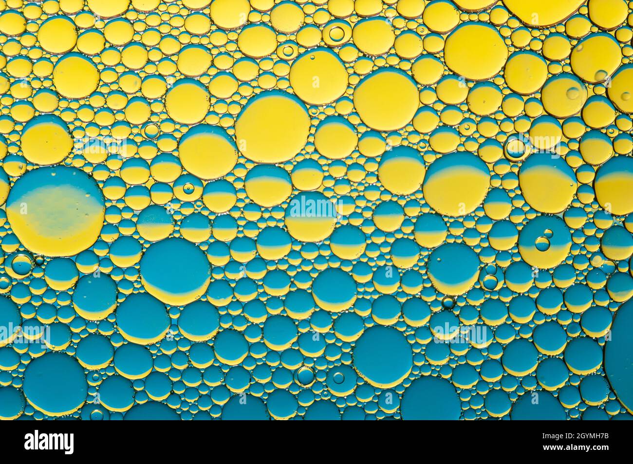 Abstract background and texture of oil drops on water with different ...