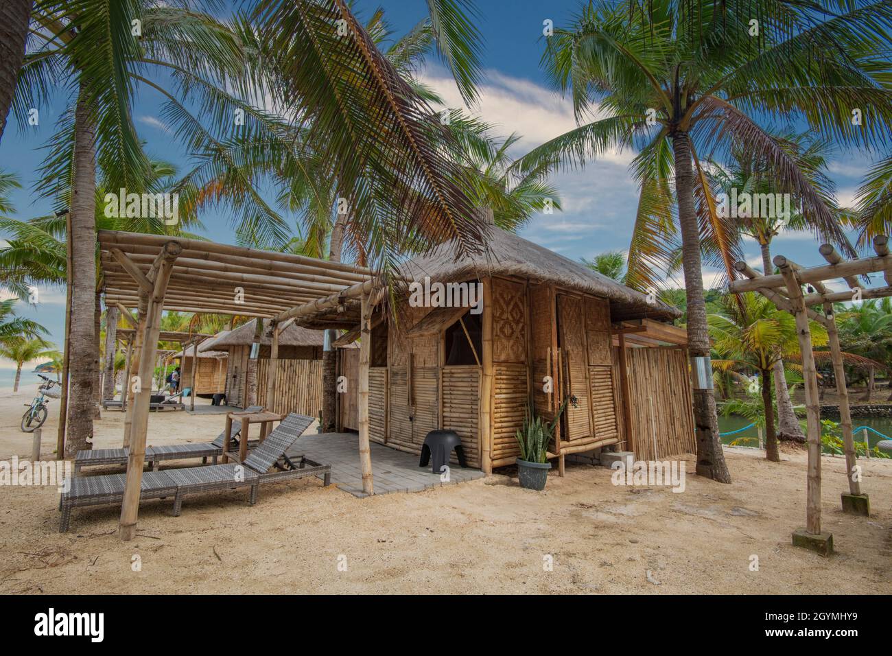 Resting spot with bungalows on a tropical beach Stock Photo - Alamy
