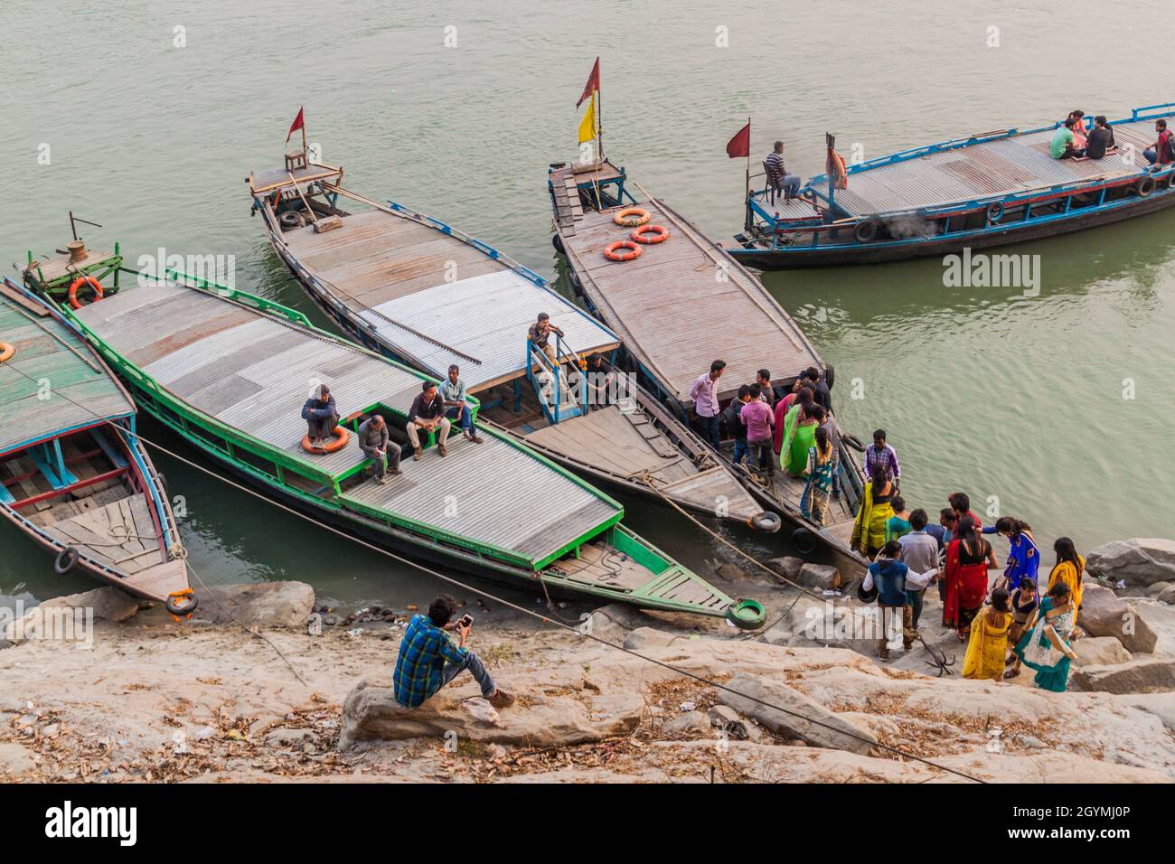 GUWAHATI, INDIA - JANUARY 31, 2017: People boarding a boat at Peacock ...