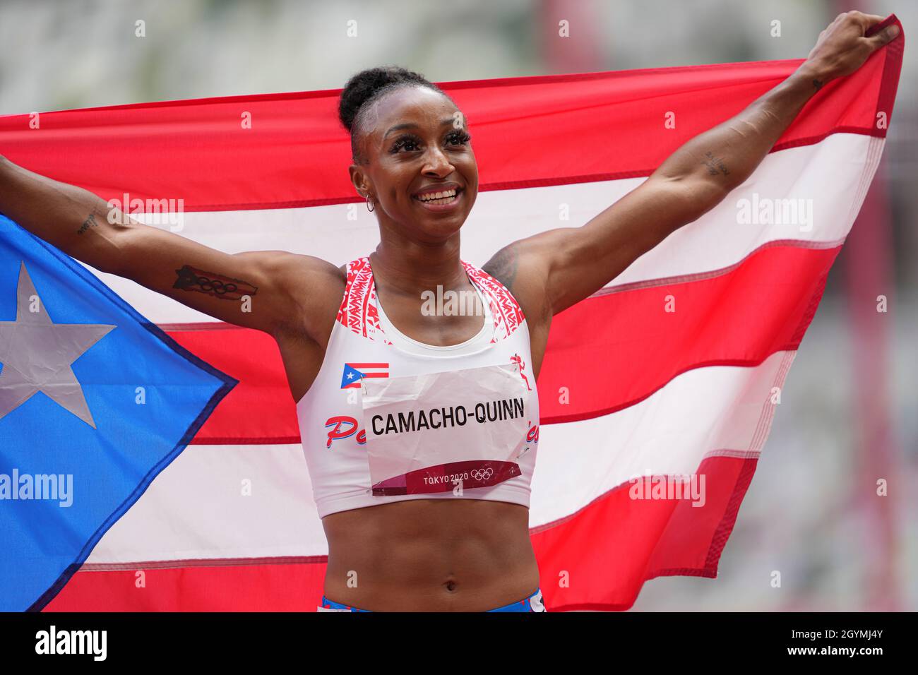 Jasmine Camacho-Quinn with her country's flag after winning gold at the ...