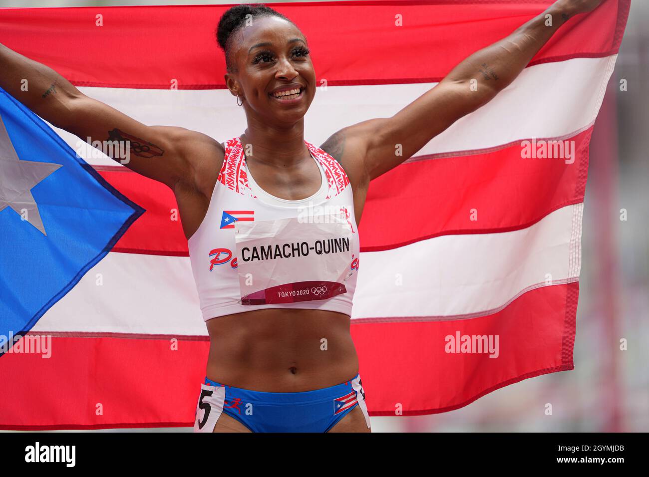 Jasmine Camacho-Quinn with her country's flag after winning gold at the ...