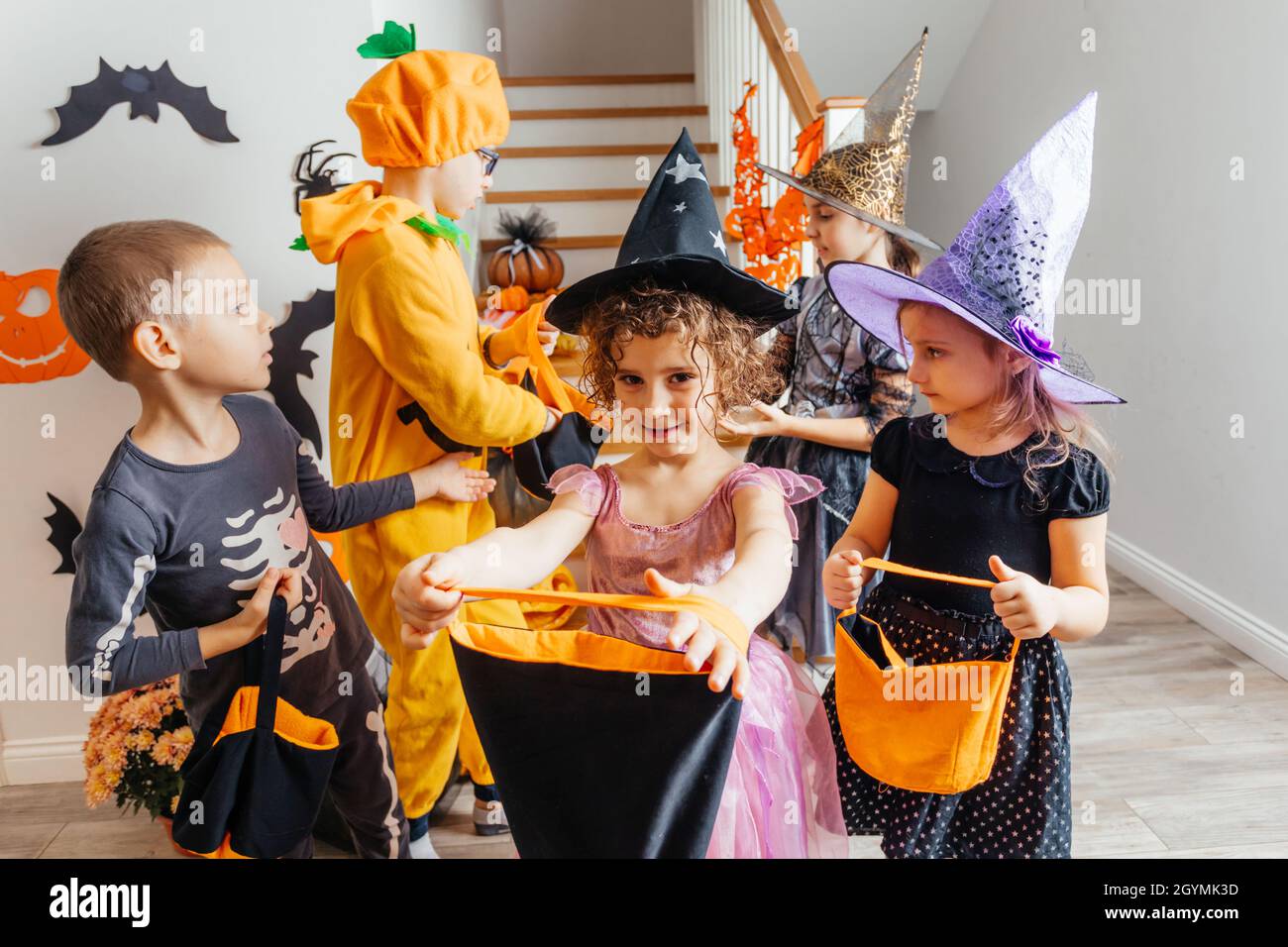 Group of kids waiting for Halloween candies Stock Photo - Alamy