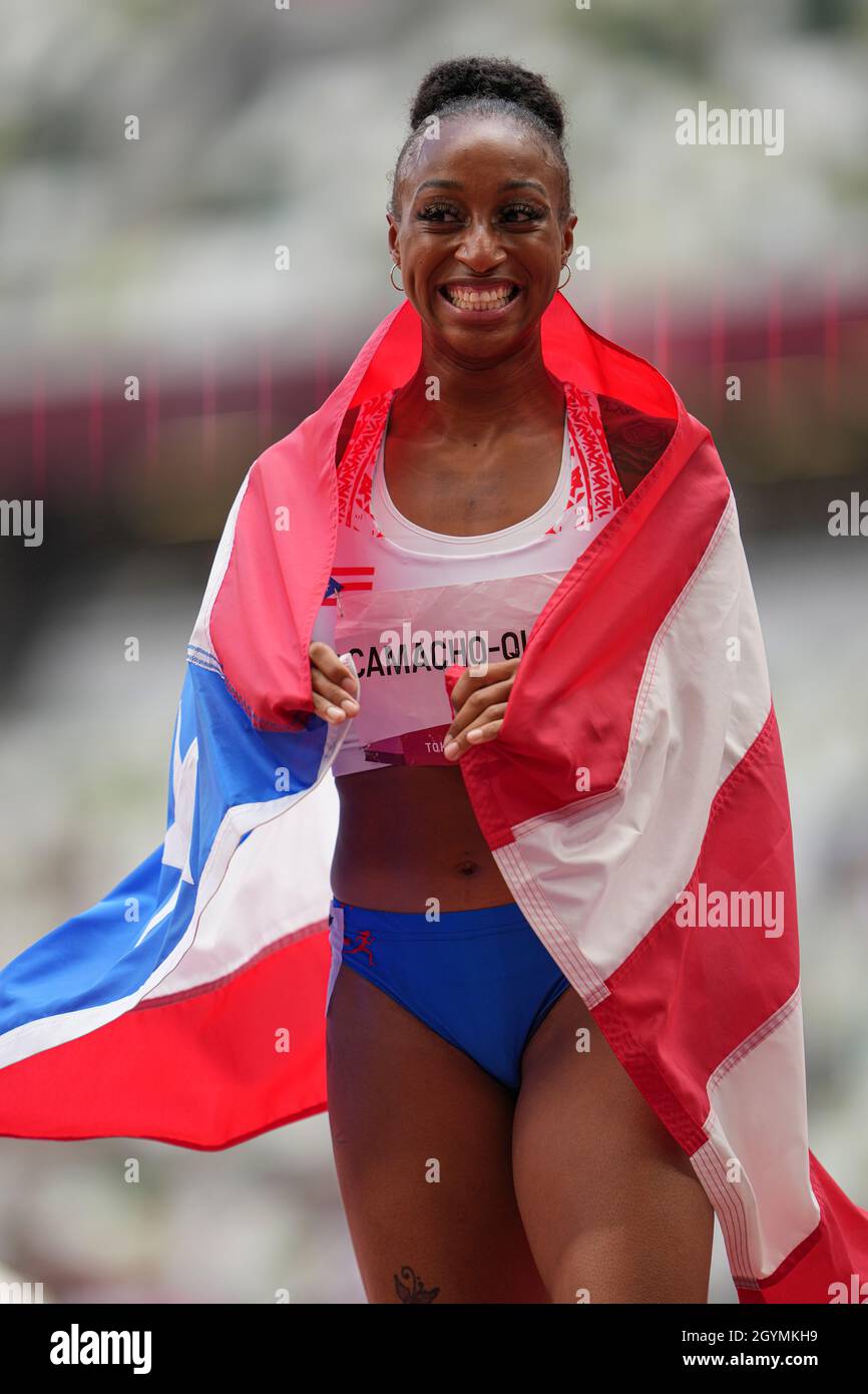 Jasmine Camacho-Quinn with her country's flag after winning gold at the ...