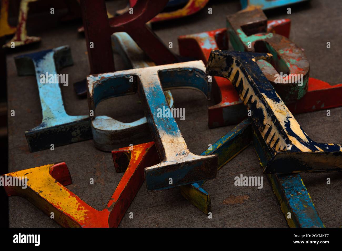 Random collection of weathered wooden letters, numbers and characters ...