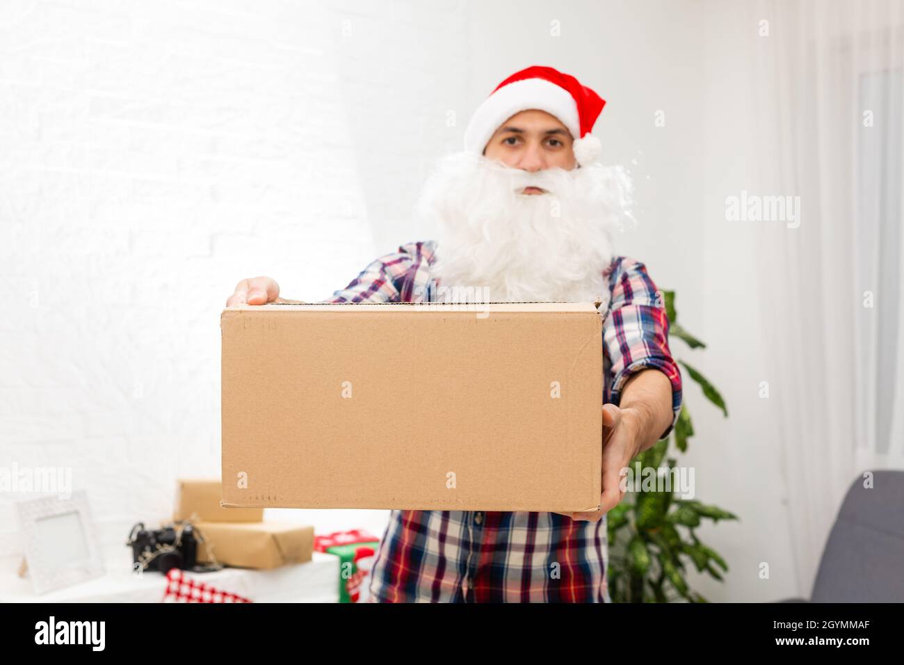 santa claus carrying a cardboard box on white background Stock Photo ...