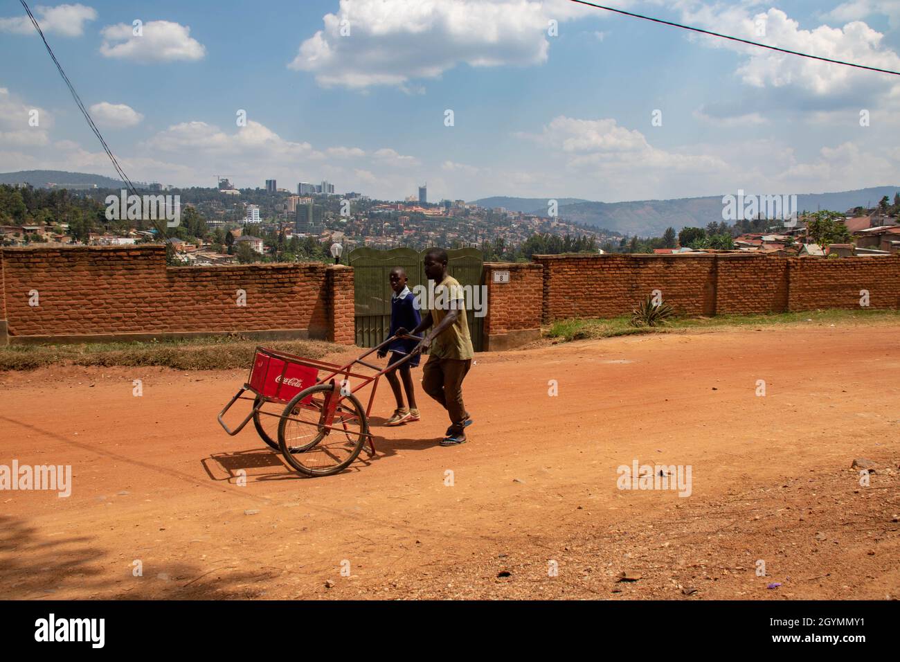 Two young boys pushing a cart. Rwanda Stock Photo - Alamy
