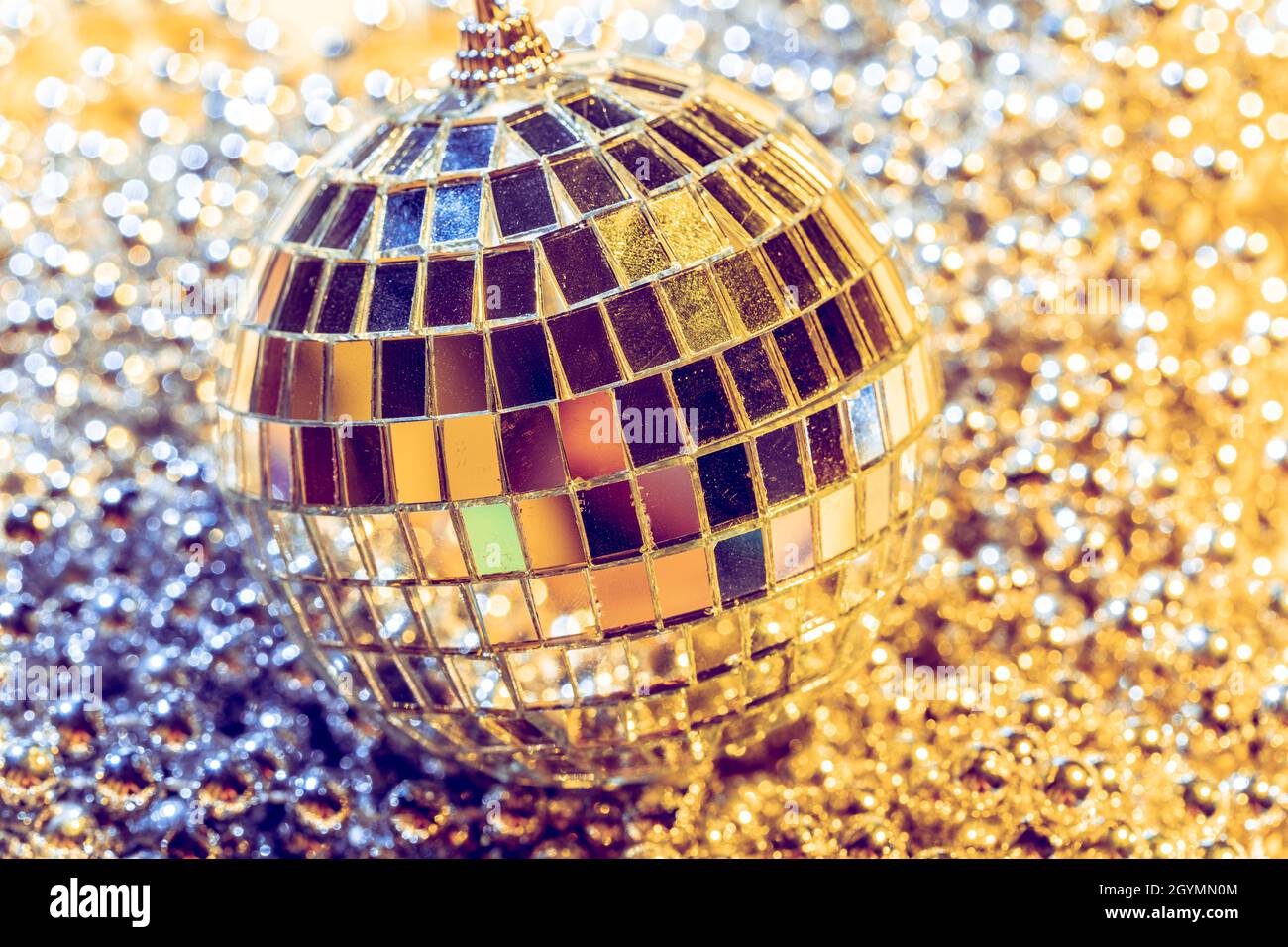 disco ball concept. Isolated on yellow background Stock Photo - Alamy