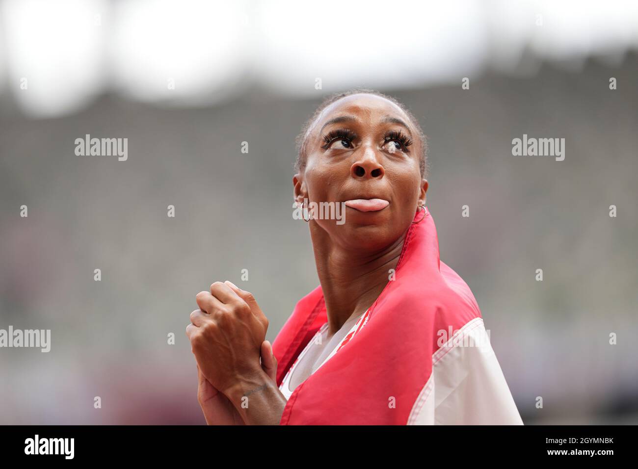 Jasmine Camacho-Quinn with her country's flag after winning gold at the ...