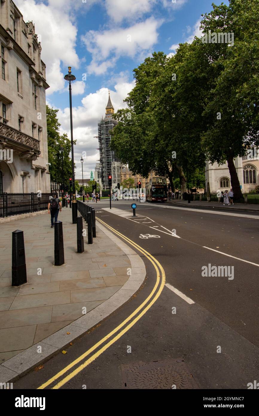 Blue footpath sign, street furniture, with Big Ben in the background ...