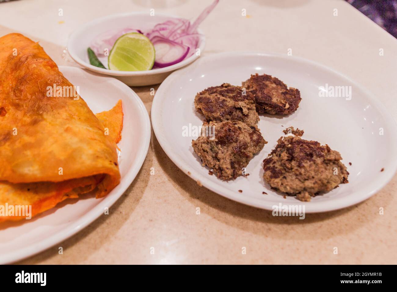 Mutton kebab with paratha, speciality of Lucknow, Uttar Pradesh state ...