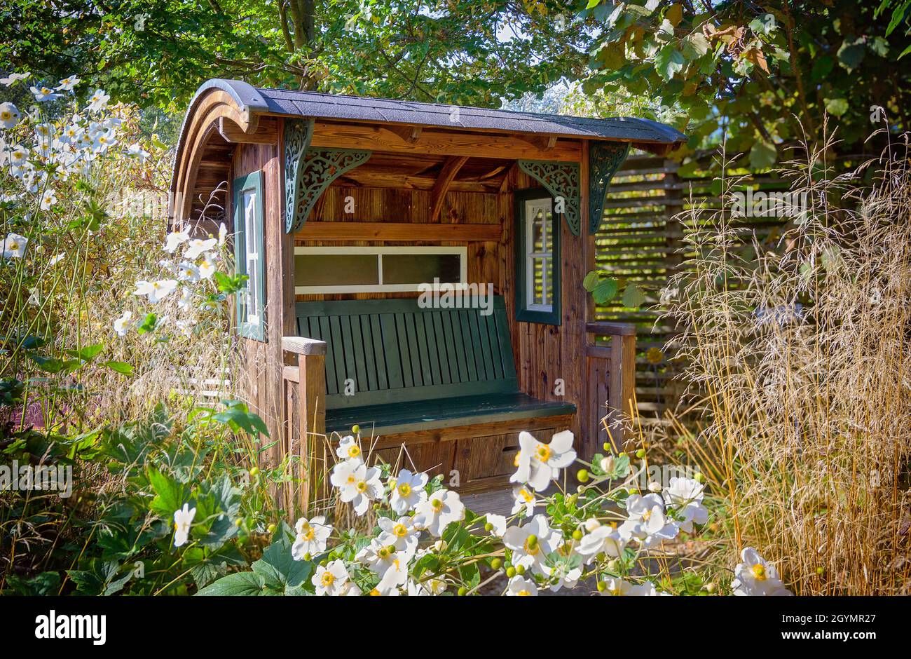 Wooden garden bower seat hi-res stock photography and images - Alamy
