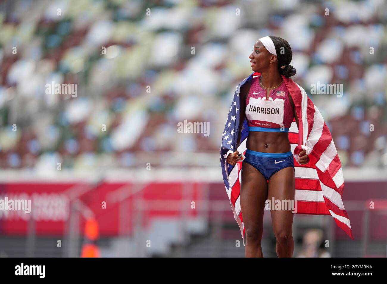 Keni Harrison with her country's flag after winning the silver medal at ...