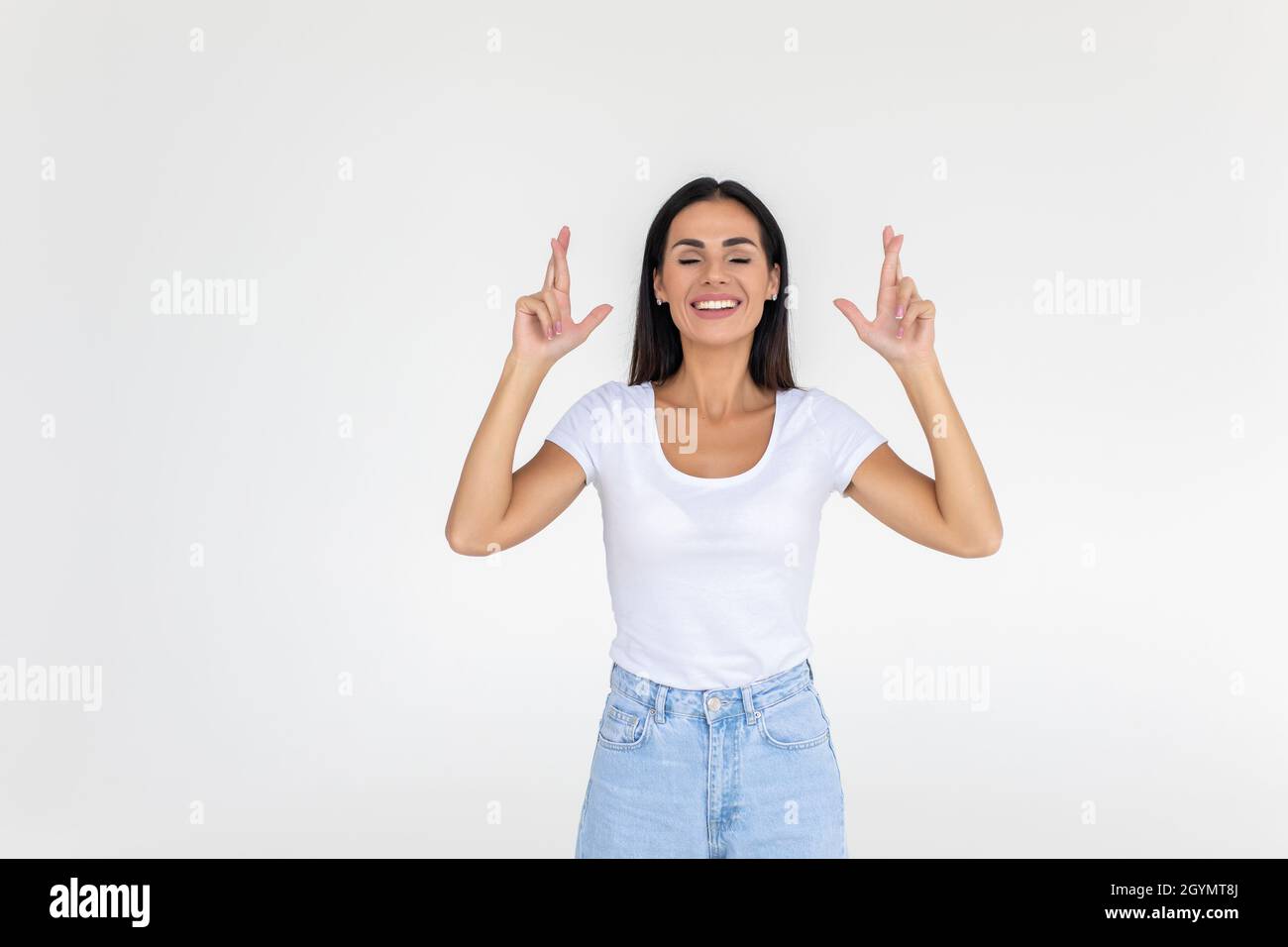 Portrait of young woman pointing hands finger at corner with copyspace ...