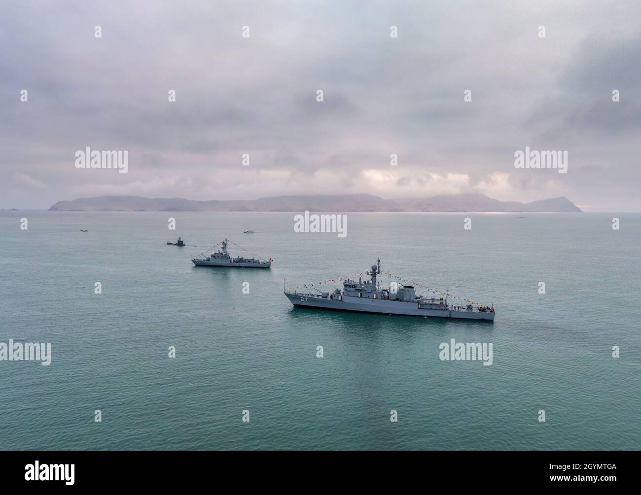 Peruvian Navy ships on the Callao harbour from Lima, Peru in a cloudy ...