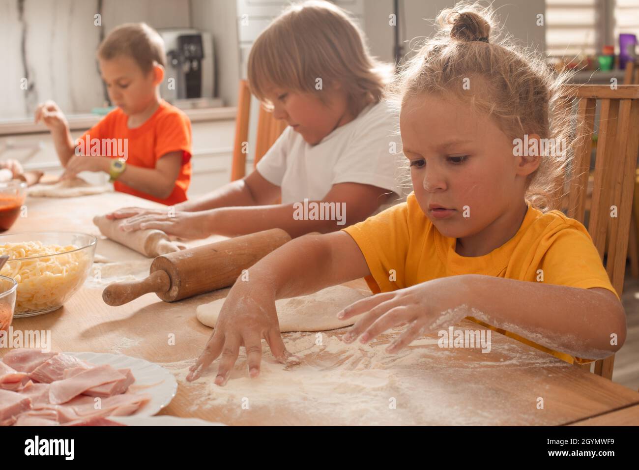 the little boy is preparing his favorite dish Stock Photo - Alamy