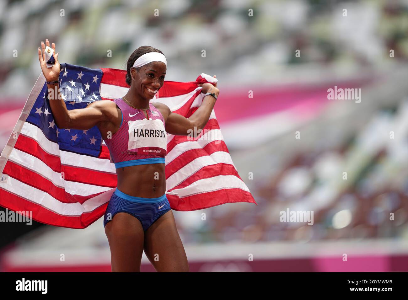 Keni Harrison with her country's flag after winning the silver medal at ...