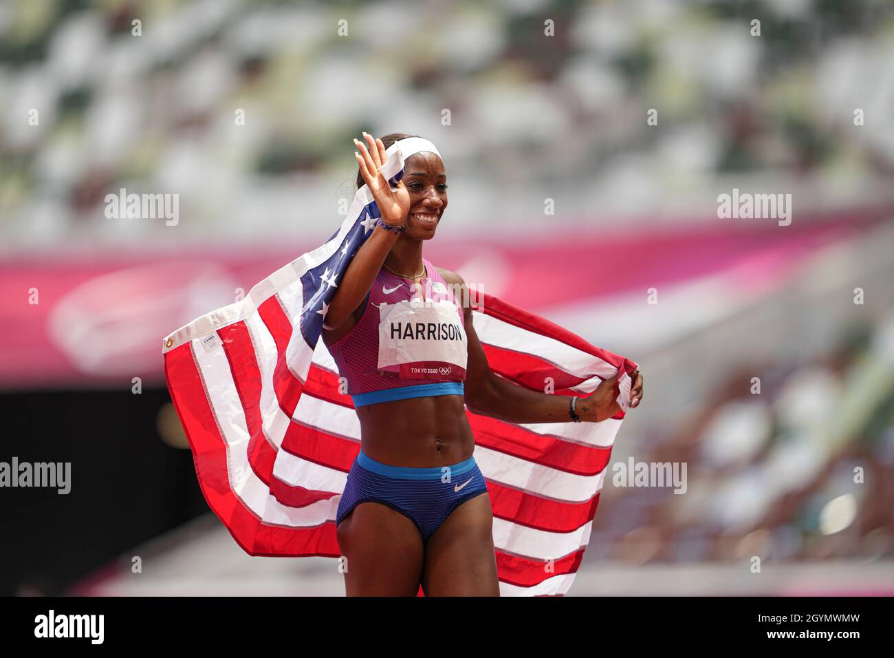 Keni Harrison with her country's flag after winning the silver medal at ...