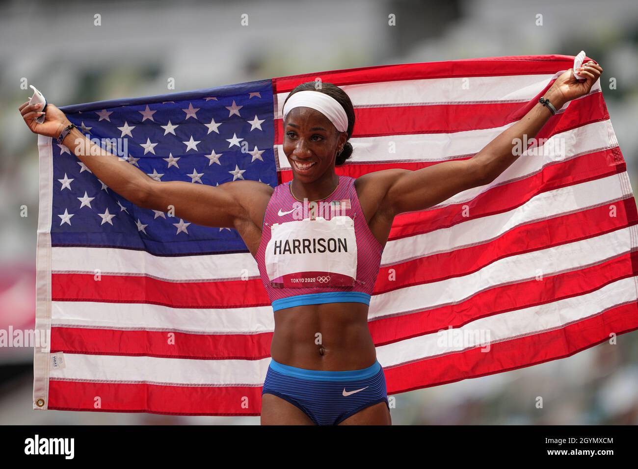 Keni Harrison with her country's flag after winning the silver medal at ...