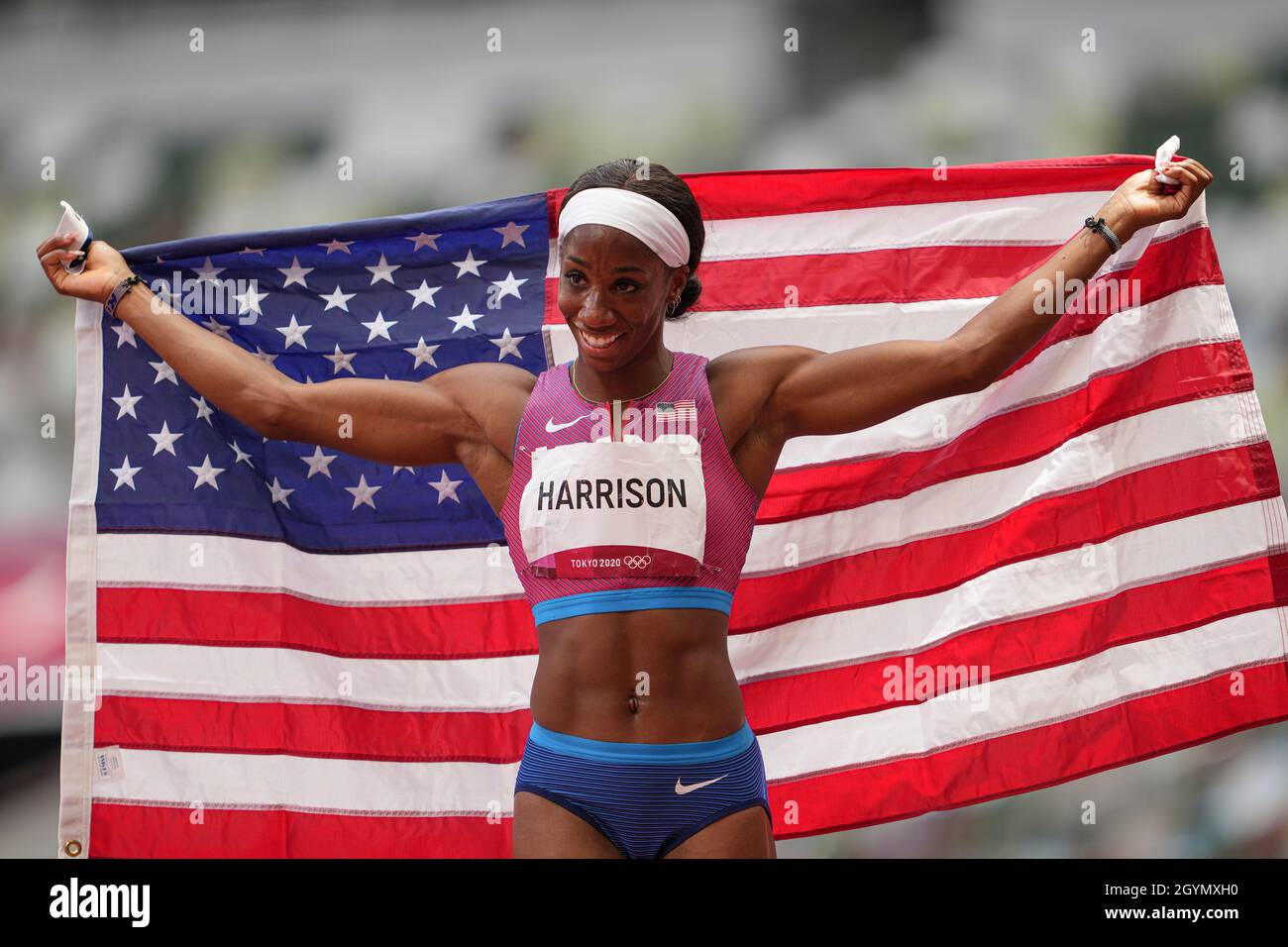 Keni Harrison with her country's flag after winning the silver medal at ...