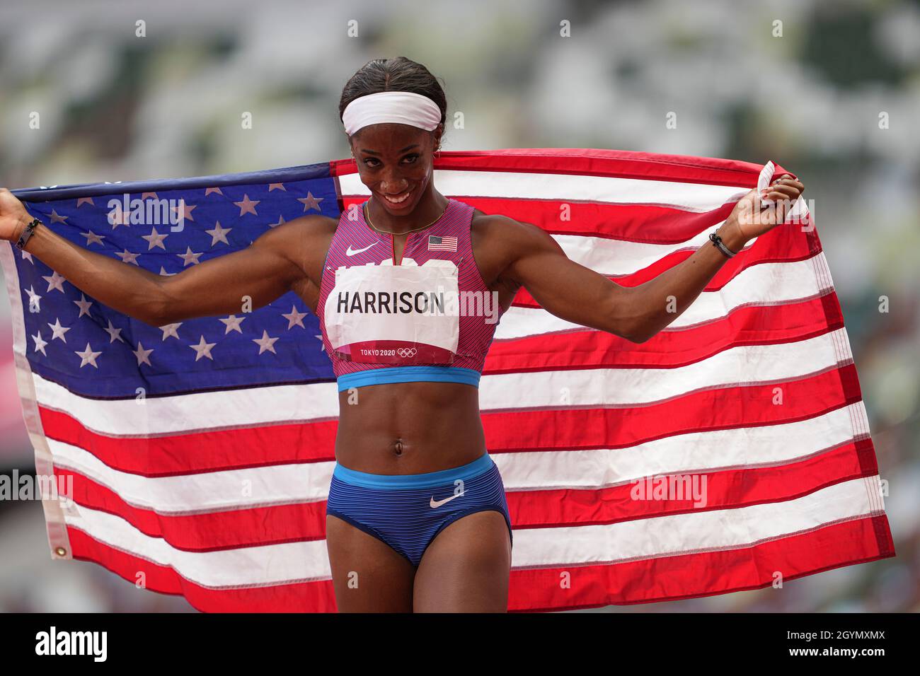 Keni Harrison with her country's flag after winning the silver medal at ...
