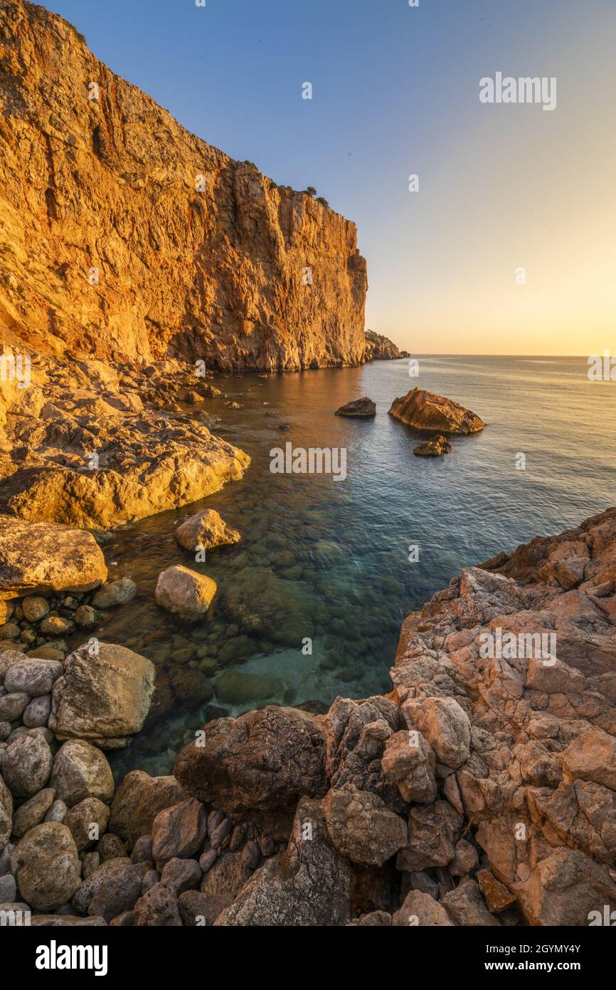 Sunrise on the beach cliffs Stock Photo - Alamy