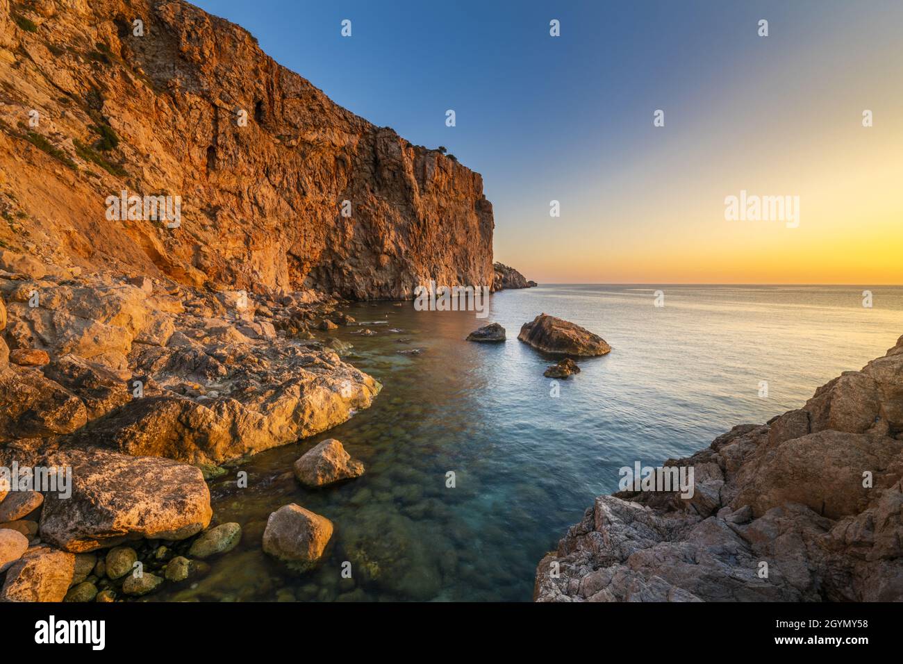 Sunrise on the beach cliffs Stock Photo - Alamy