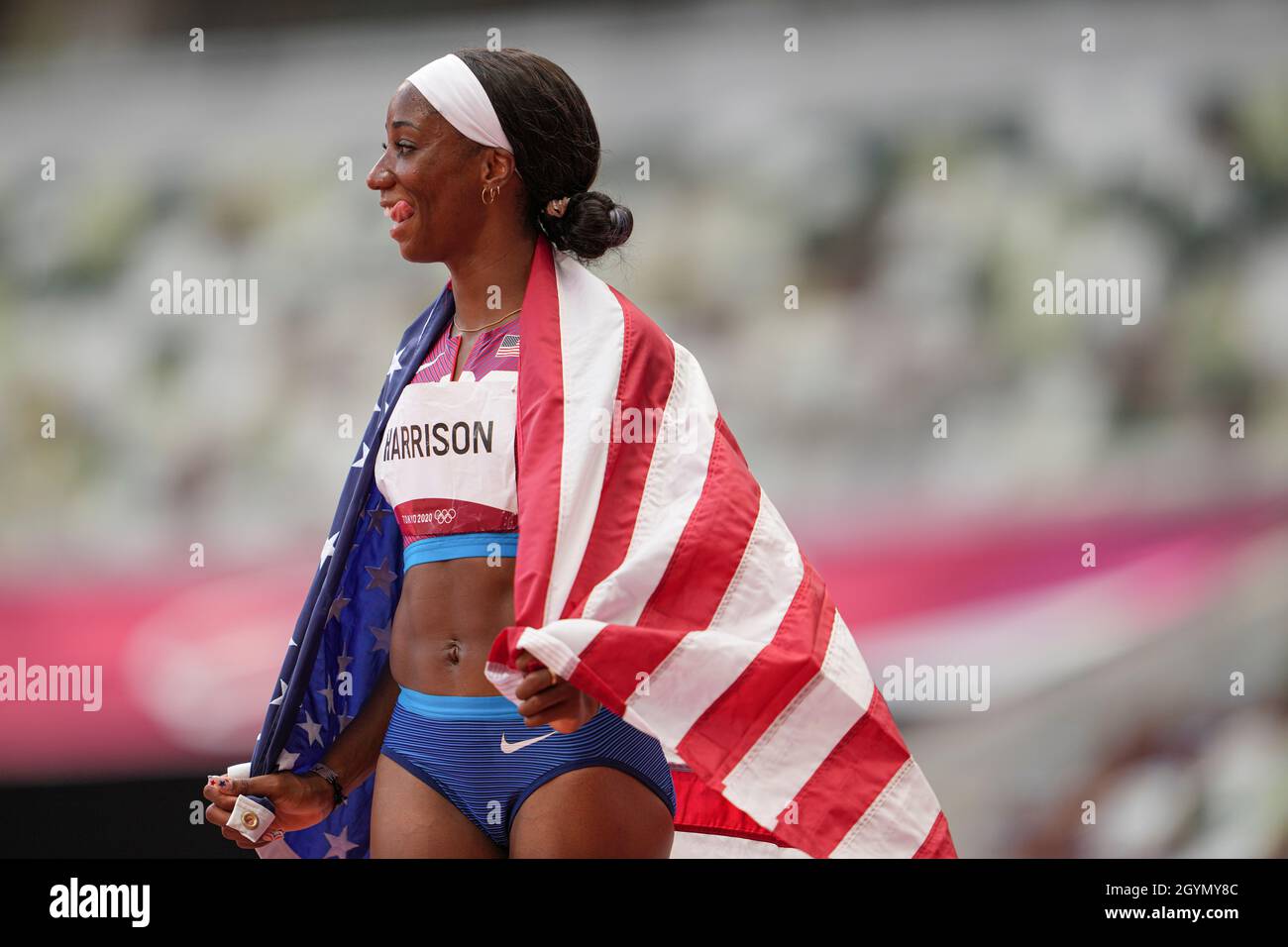 Keni Harrison with her country's flag after winning the silver medal at ...
