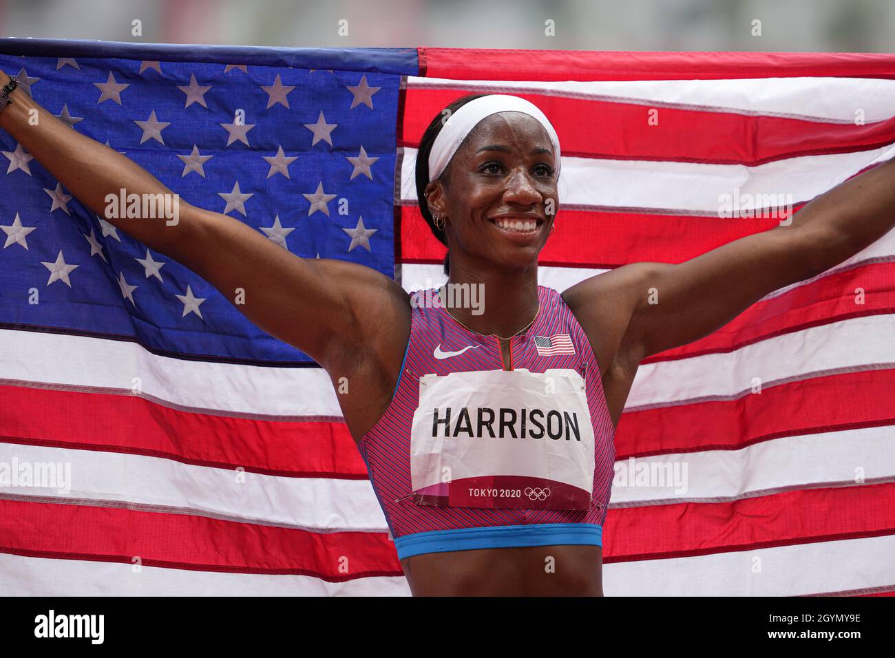 Keni Harrison with her country's flag after winning the silver medal at ...