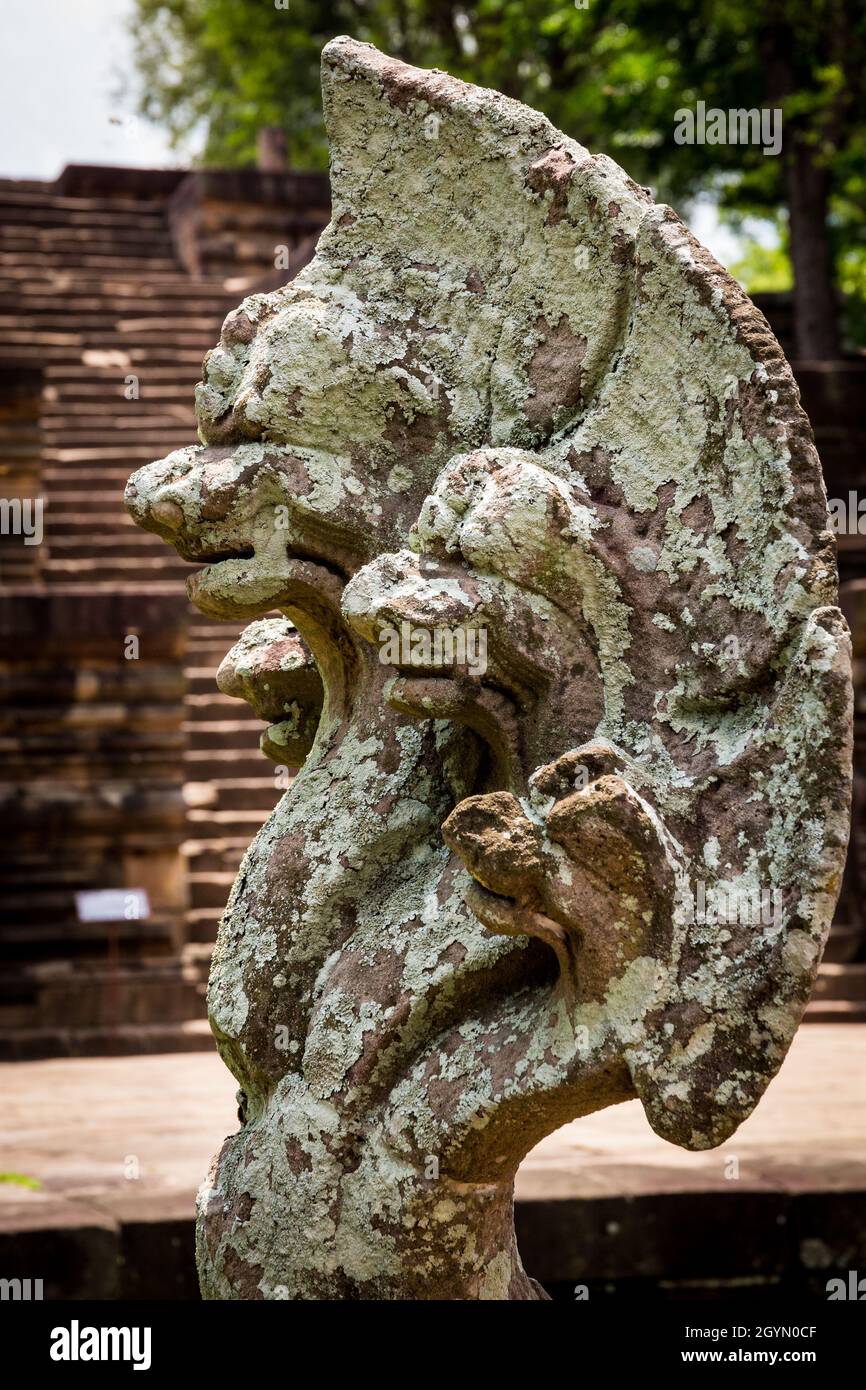 Selective closeup of an old cracked statue of snakes Stock Photo - Alamy