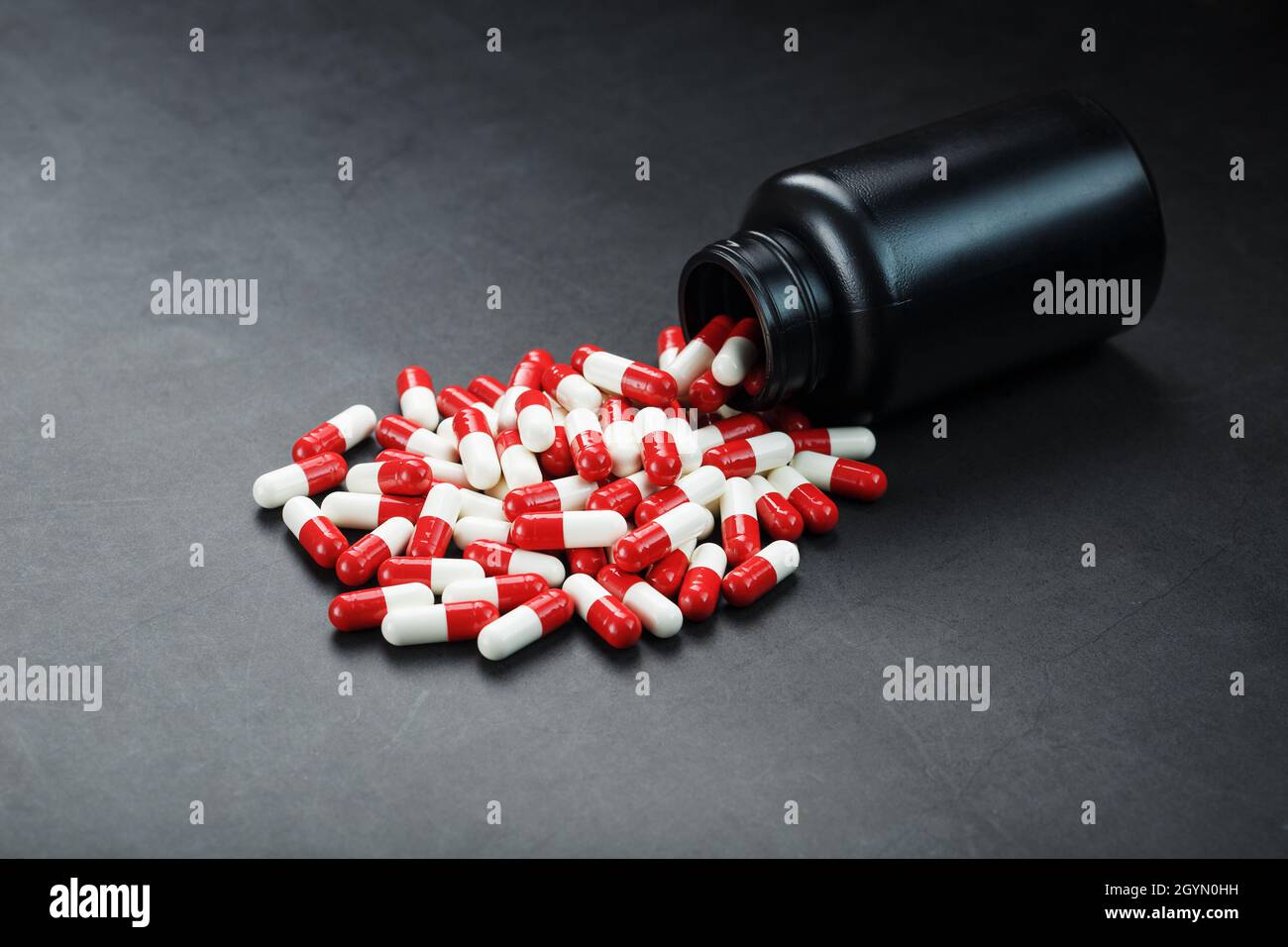 Red white capsules measuring cup hi-res stock photography and images ...