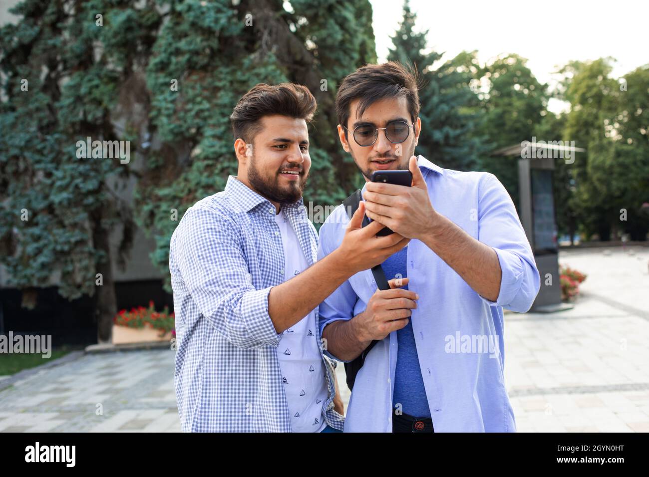 Two students help your classmate with navigation Stock Photo - Alamy