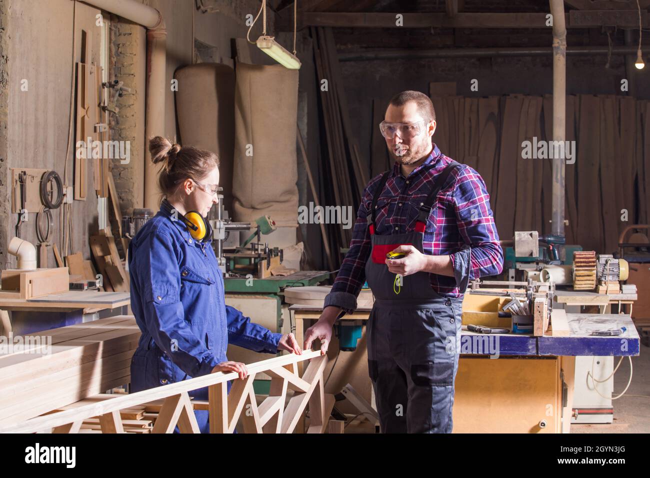 Creative craftspersons producing handmade wooden furniture decor Stock ...