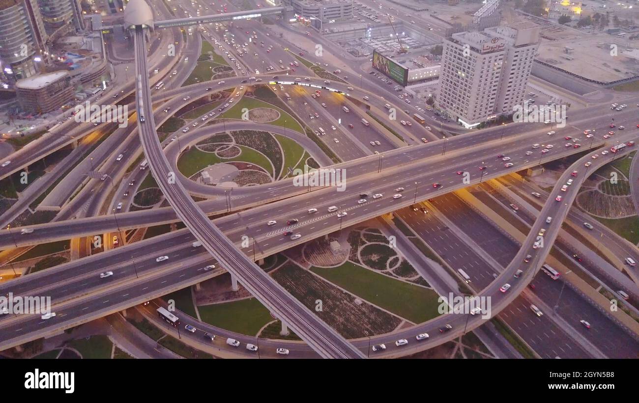 Aerial top view of highway junction with traffic in Dubai, UAE, at ...