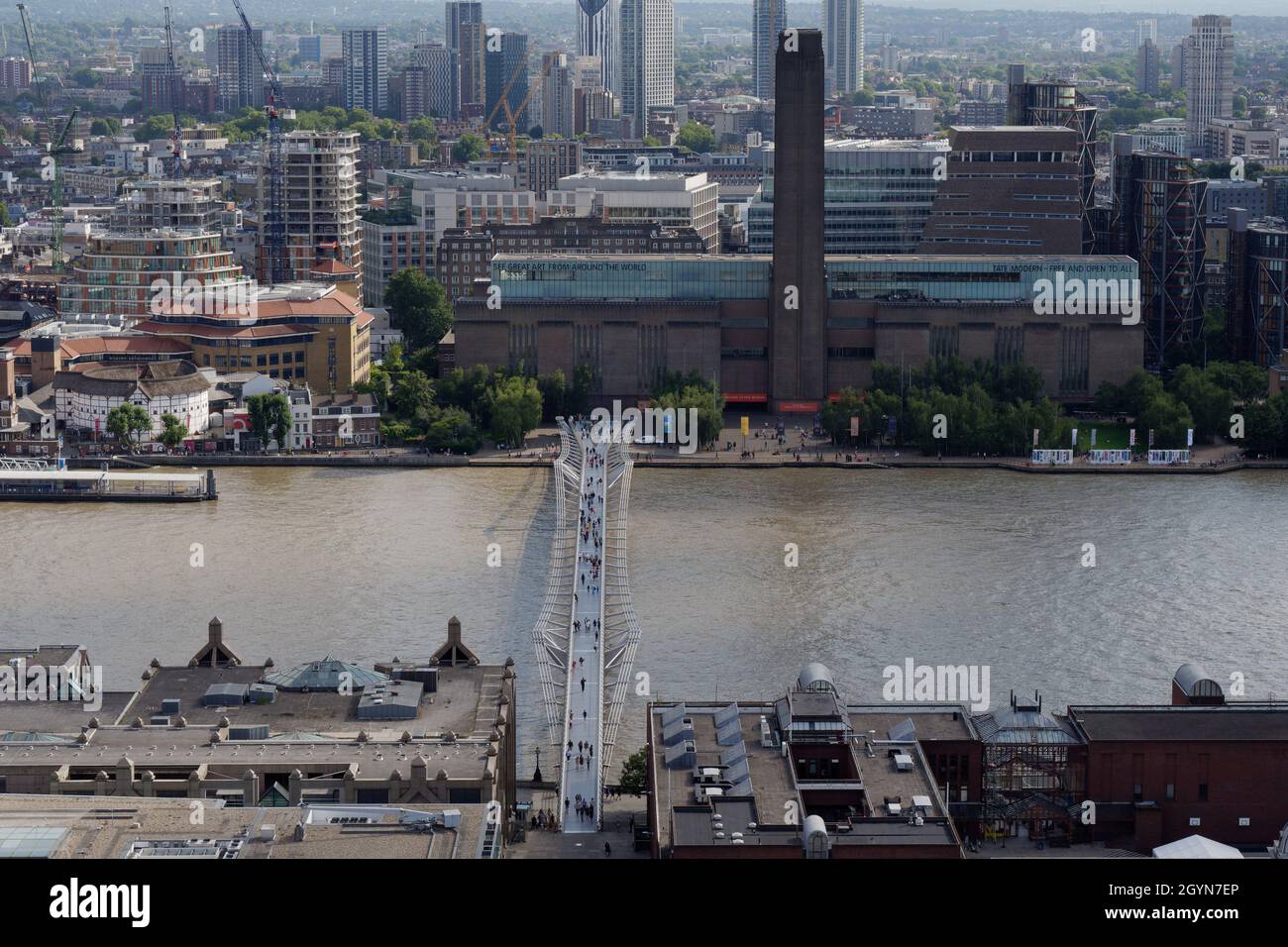 Aerial view towards the Millennium Bridge over the River Thames with ...