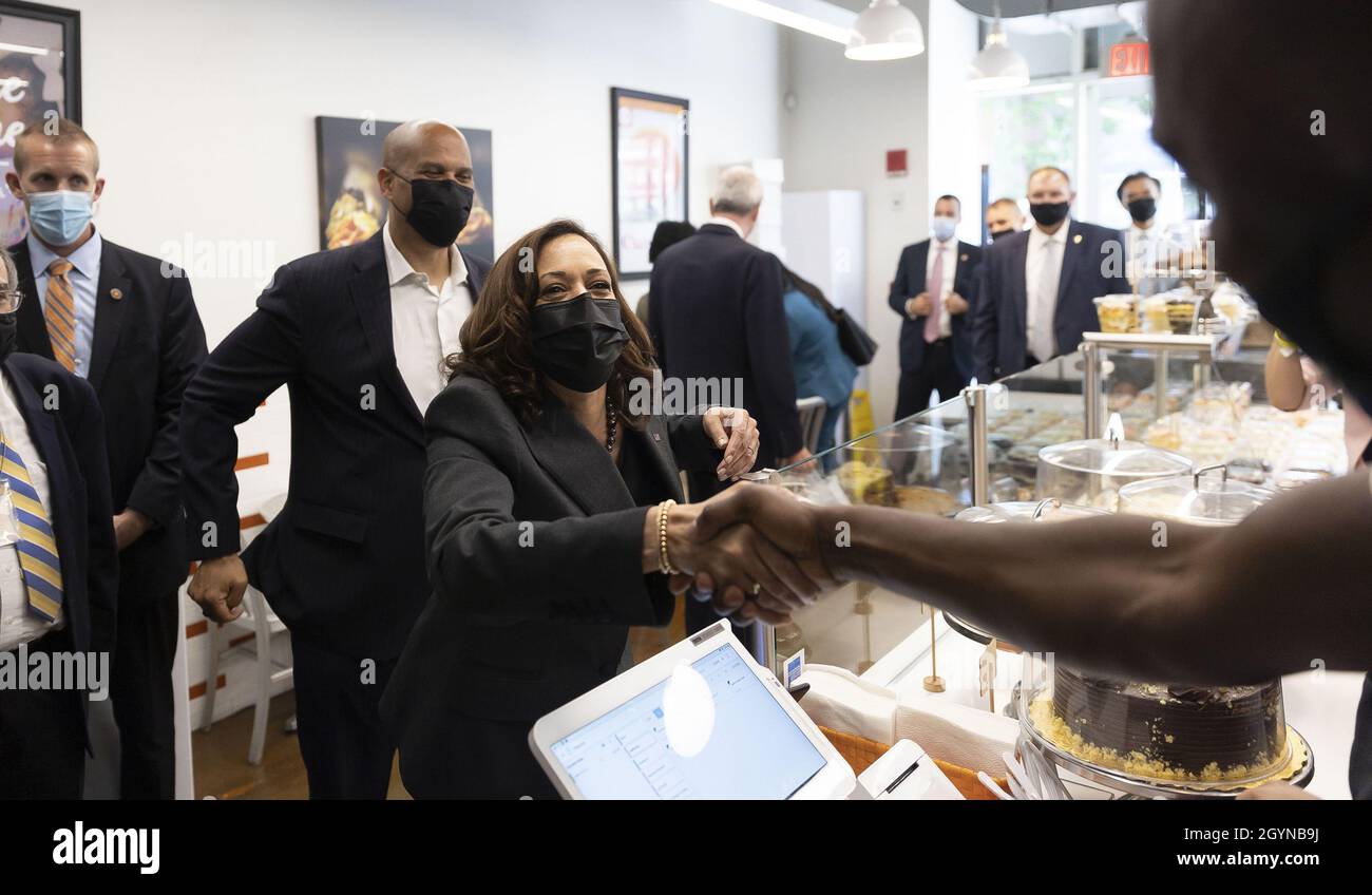 Newark, USA. 08th Oct, 2021. Vice President Kamala Harris (C) shakes ...