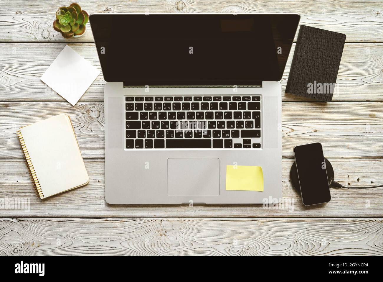 Office table workspace top view. Wooden desk with laptop, devices and ...