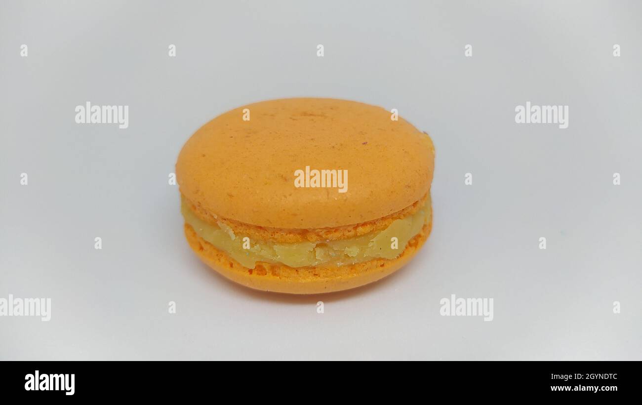 Closeup shot of a yellow macaroon isolated on a white background Stock ...