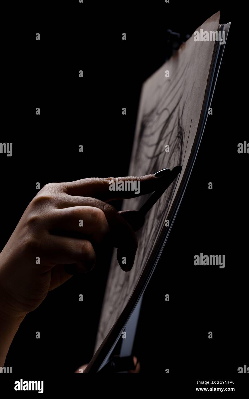 Artist drawing with chalk. Abstract hand painting on paper against ...