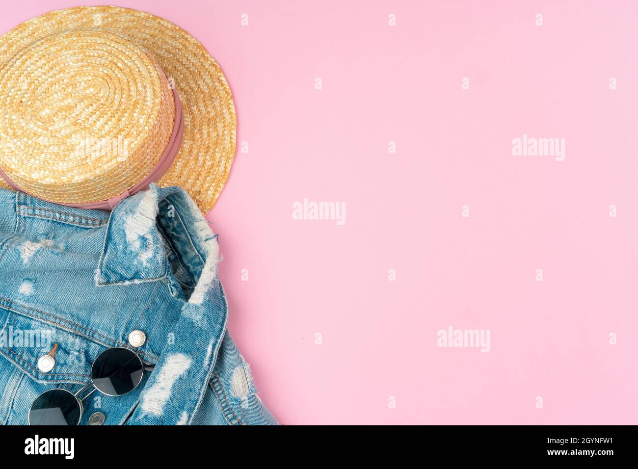 Stylish summer outfit for woman on pastel pink background Stock Photo ...