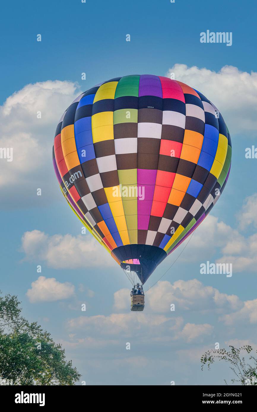Balloon in Sky Over Trees Stock Photo - Alamy