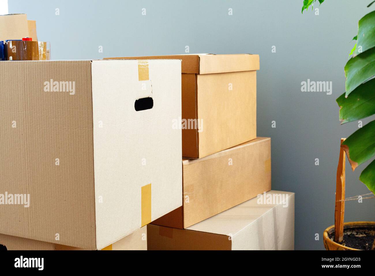House moving concept with stacked cardboard boxes in a room Stock Photo ...