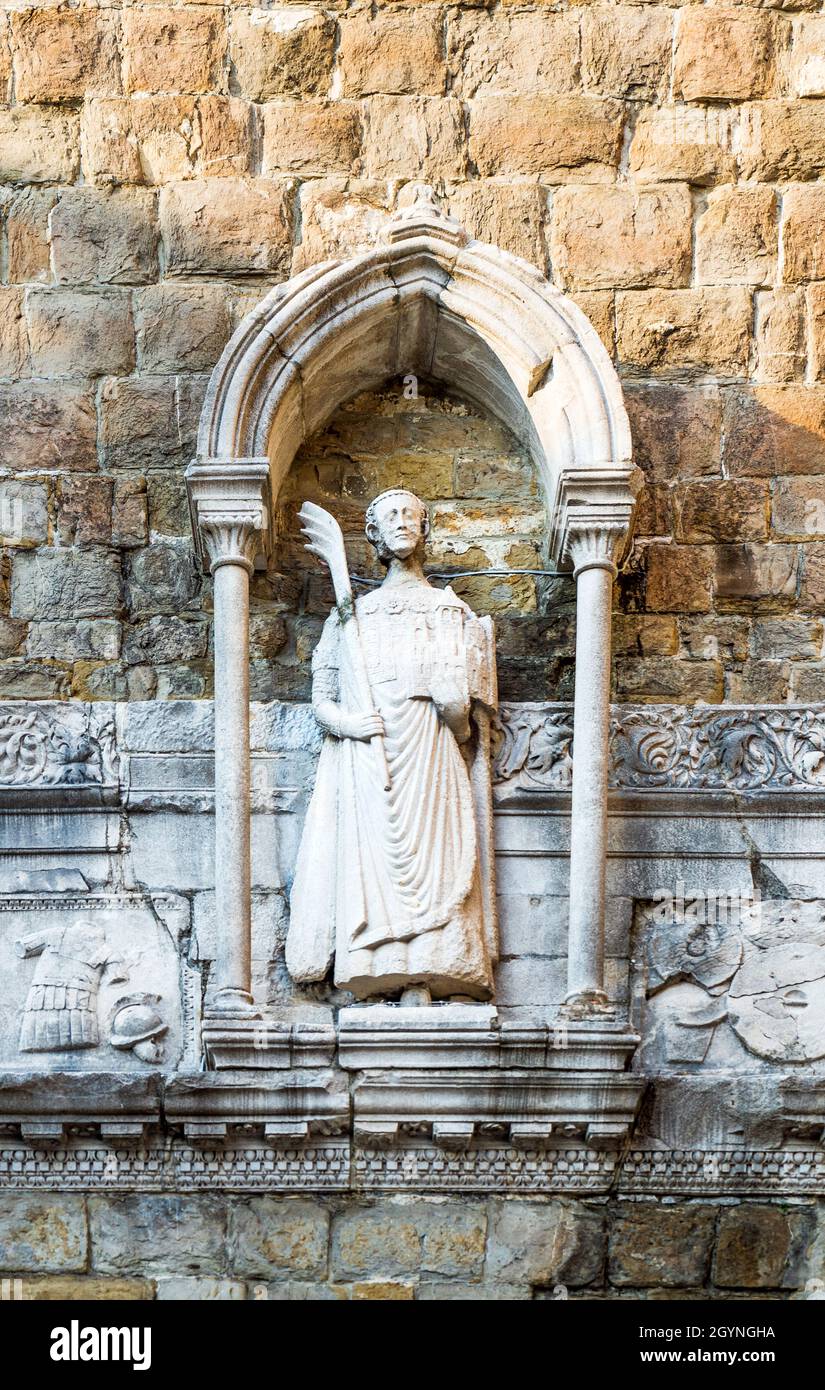 Statue of Saint Justus on the external wall of the bell tower of ...