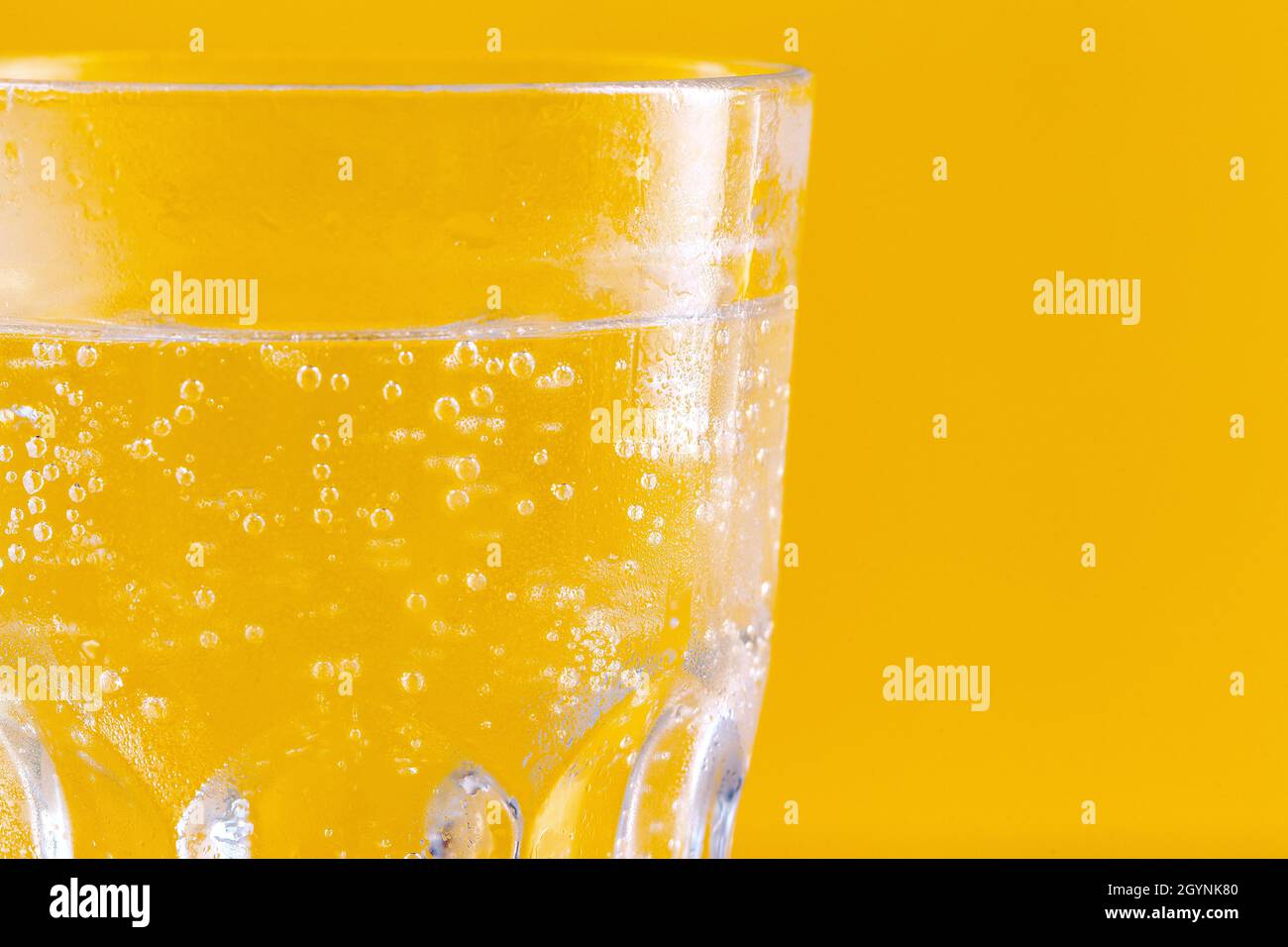 Glass of water on yellow background. Healthy lifestyle Stock Photo - Alamy