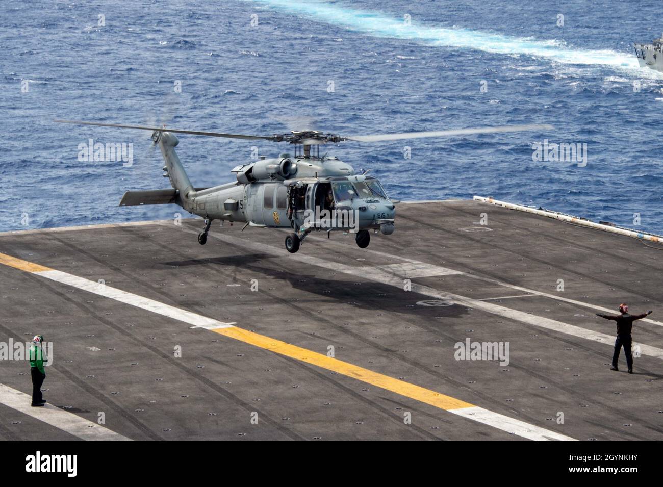 211003-N-RO680-1783 PHILIPPINE SEA (Oct. 3, 2021) An MH-60S Seahawk ...